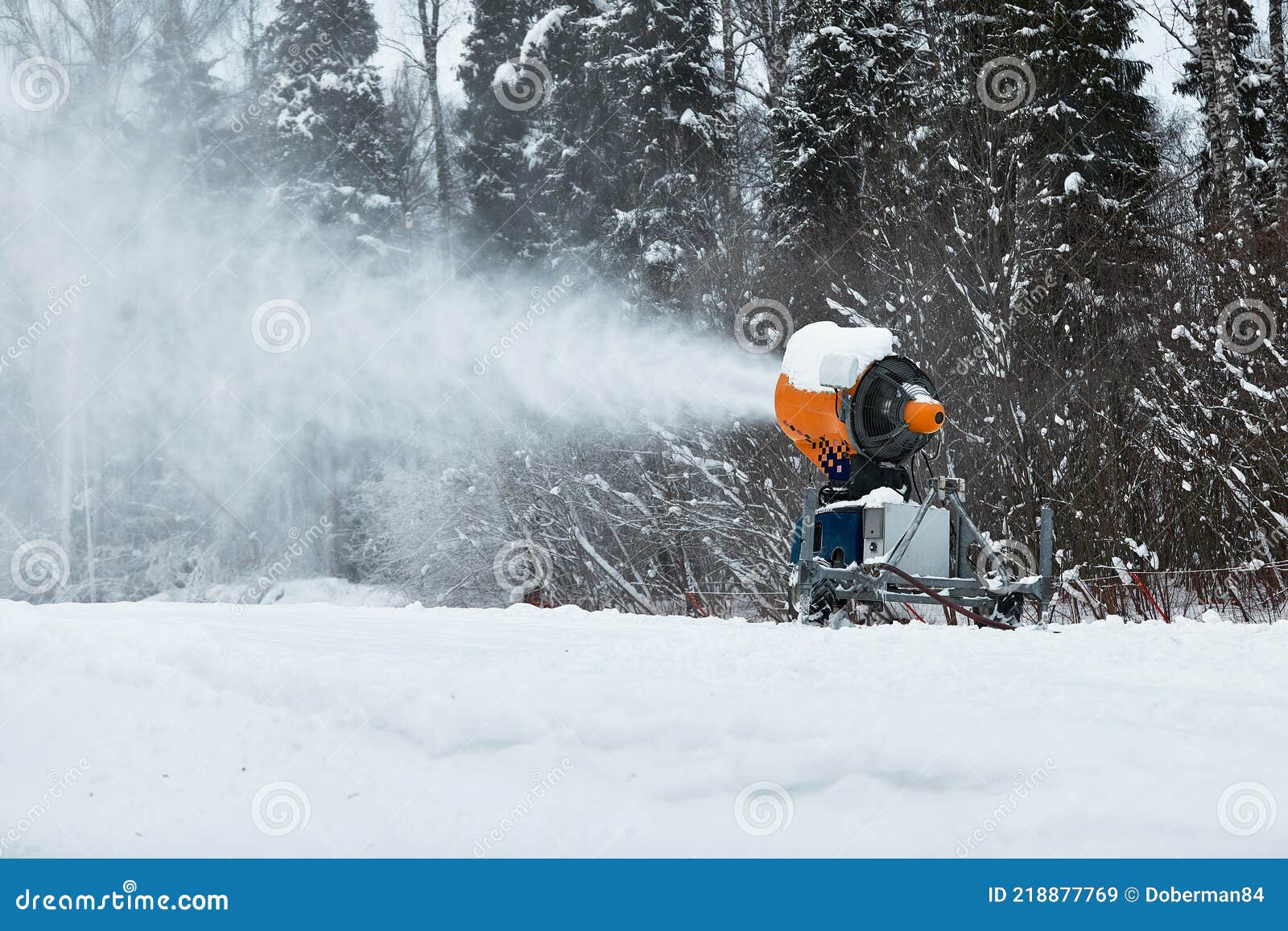 Snow Cannon Spraying Out a Fresh Dusting of Snow on the Ski Slopes ...
