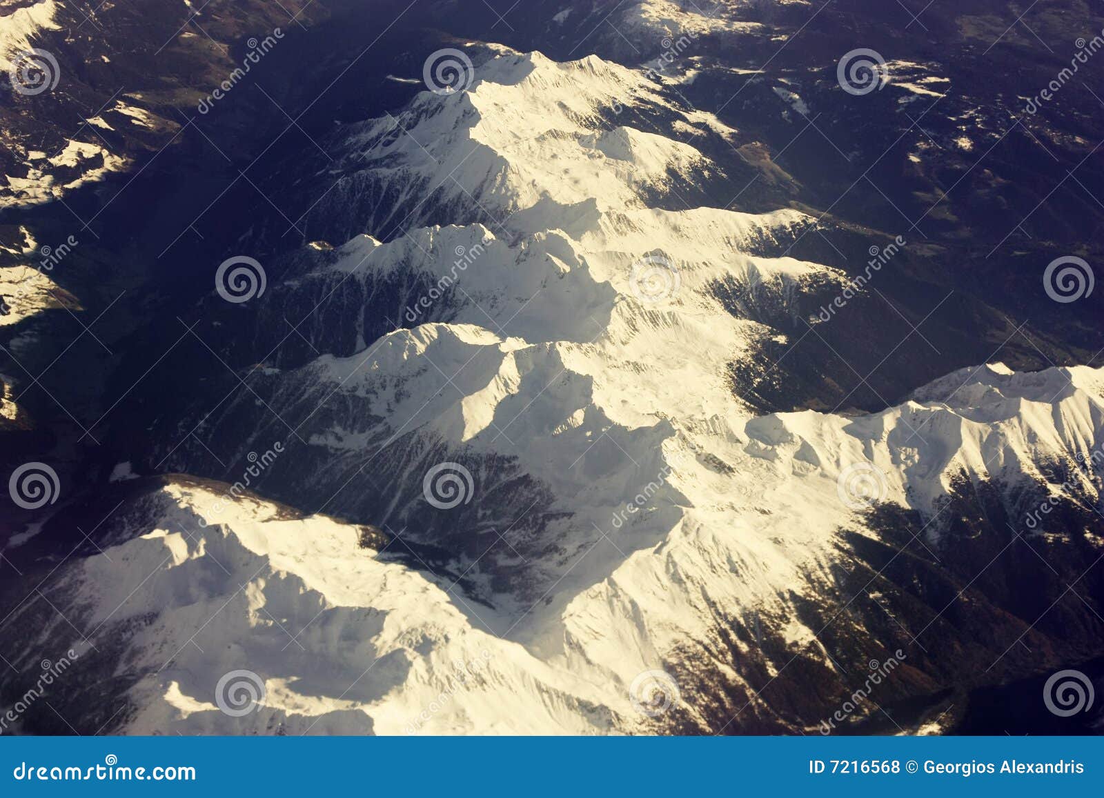 Snow-Capped Mountain Range from Above Stock Photo - Image of sidelit ...