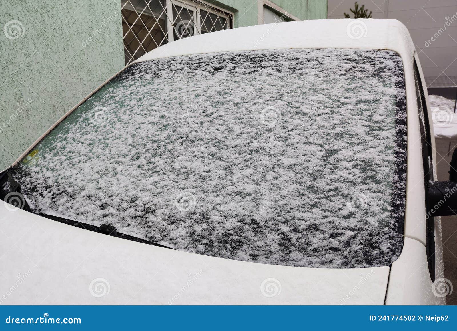 Snow on the Car Windshield. a Snowy White Car in Winter Stock Photo ...