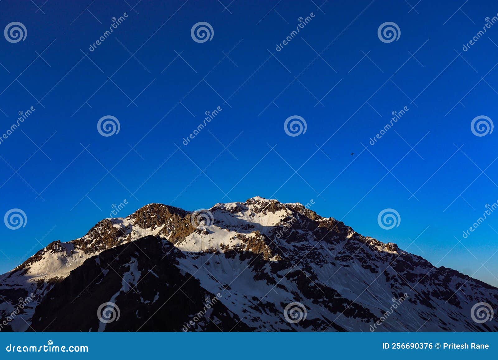 A Snow Cladded Mountain with a Clear Blue Sky Stock Photo - Image of ...