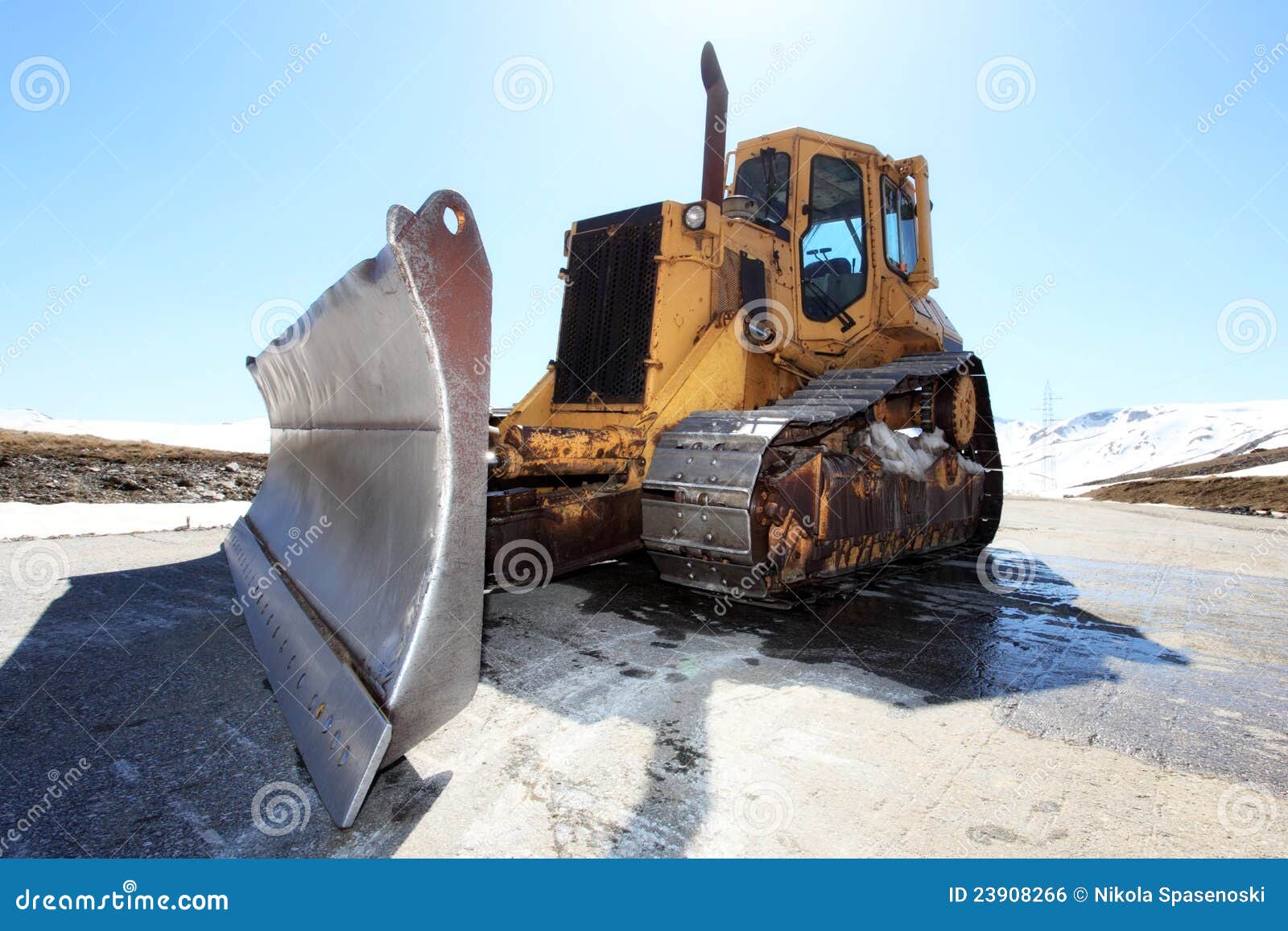 Snow-cleaning bulldozer stock photo. Image of bulldozer - 23908266
