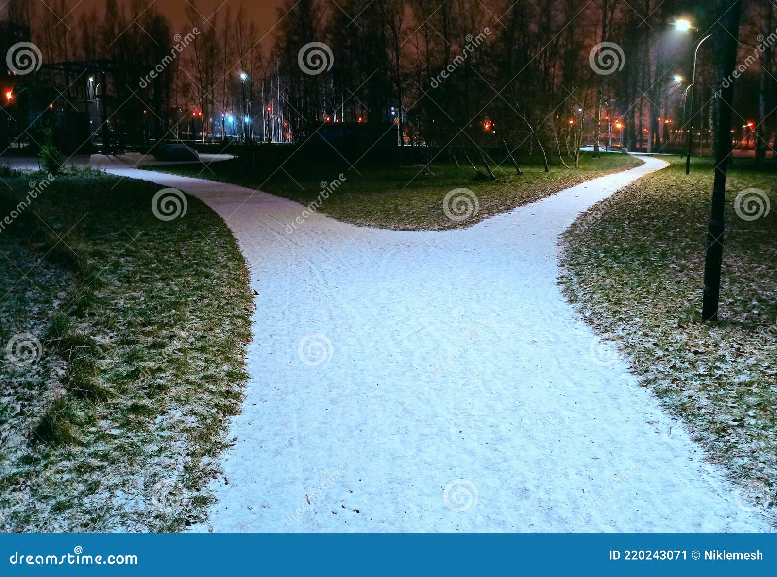 The Snow-covered Alley Divides into Two Directions at Dusk, Leading in ...