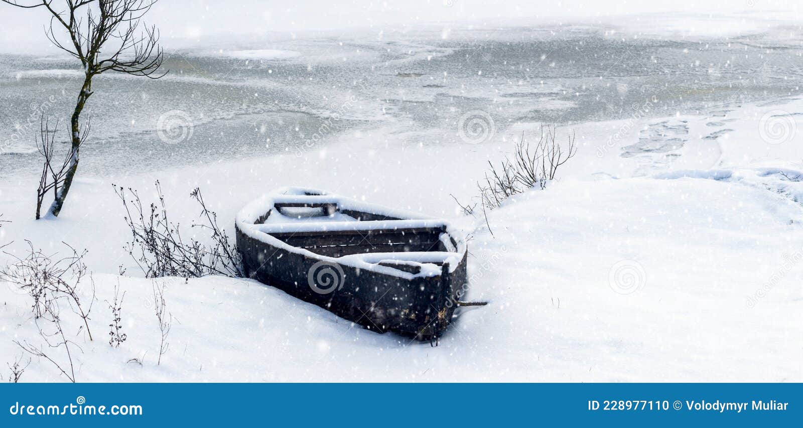 Snow-covered Boat on the River in Winter during a Snowfall Stock Photo ...