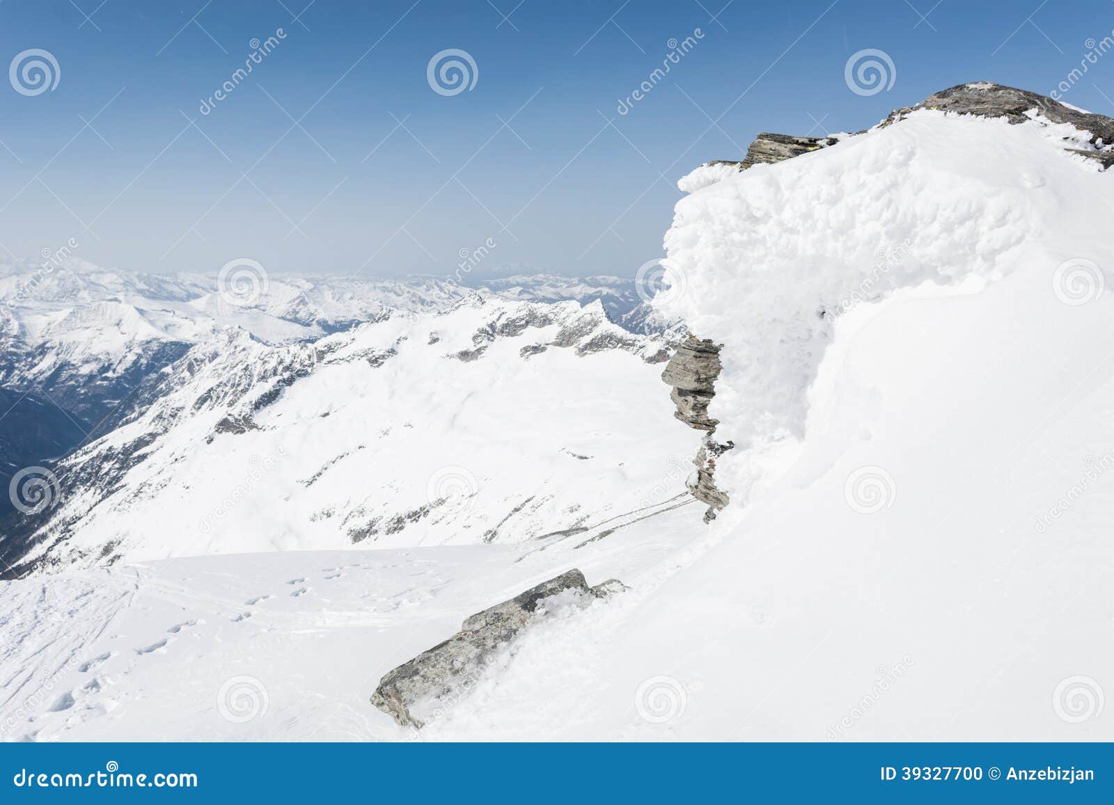 Snow Covered Boulder in Front of a Mountain View Stock Photo - Image of ...