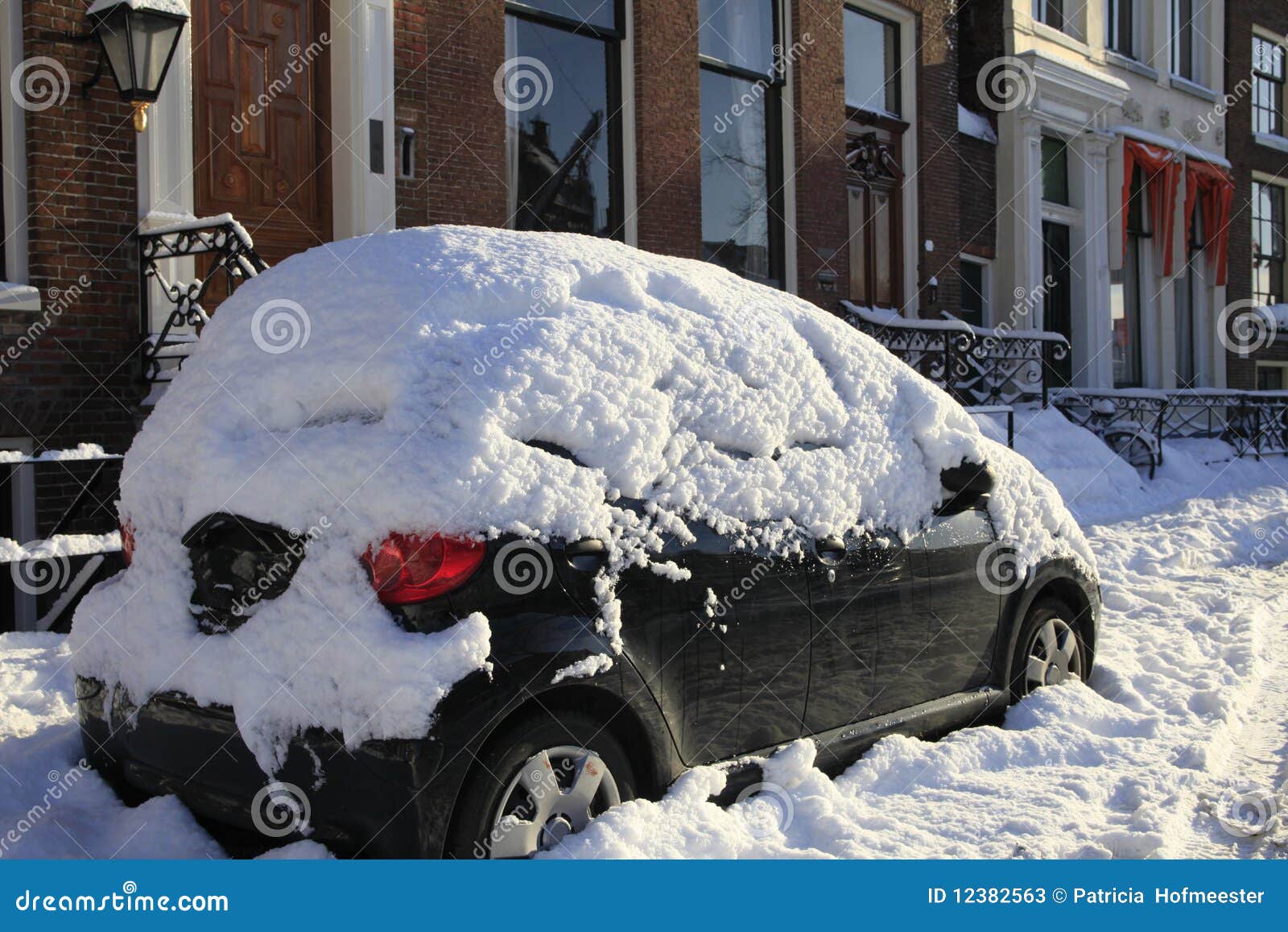 Snow covered car stock image. Image of street, alive - 12382563
