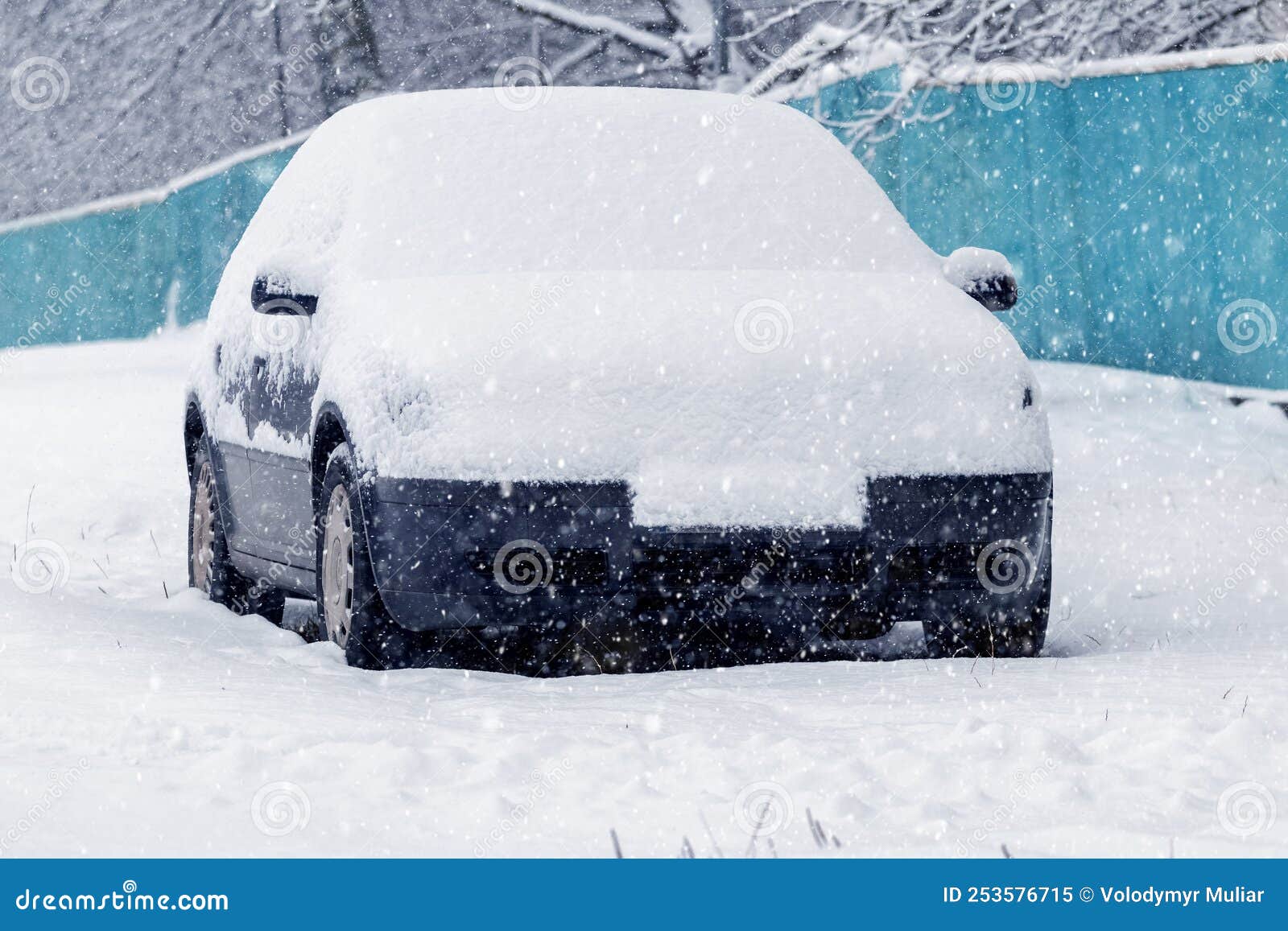A Snow-covered Car on the Roadside during a Snowfall Stock Image ...