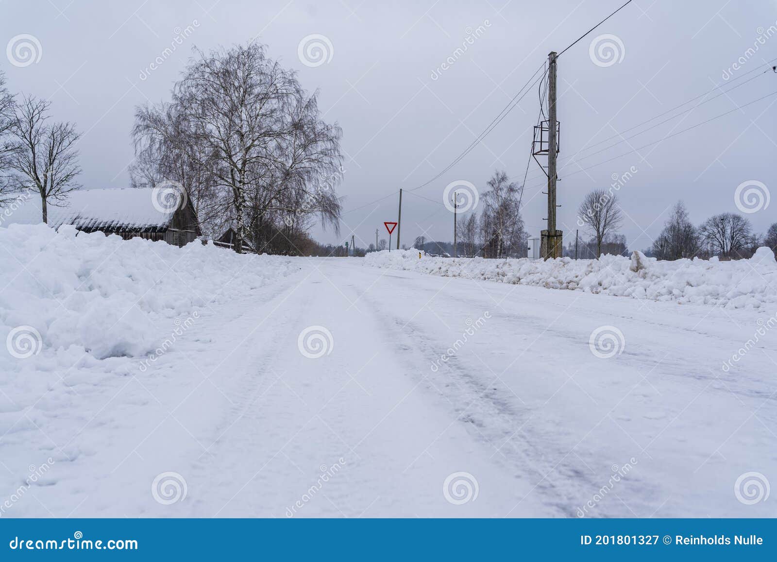 Snow Covered Countryside Road with Snow Piles on Sides Stock Image ...