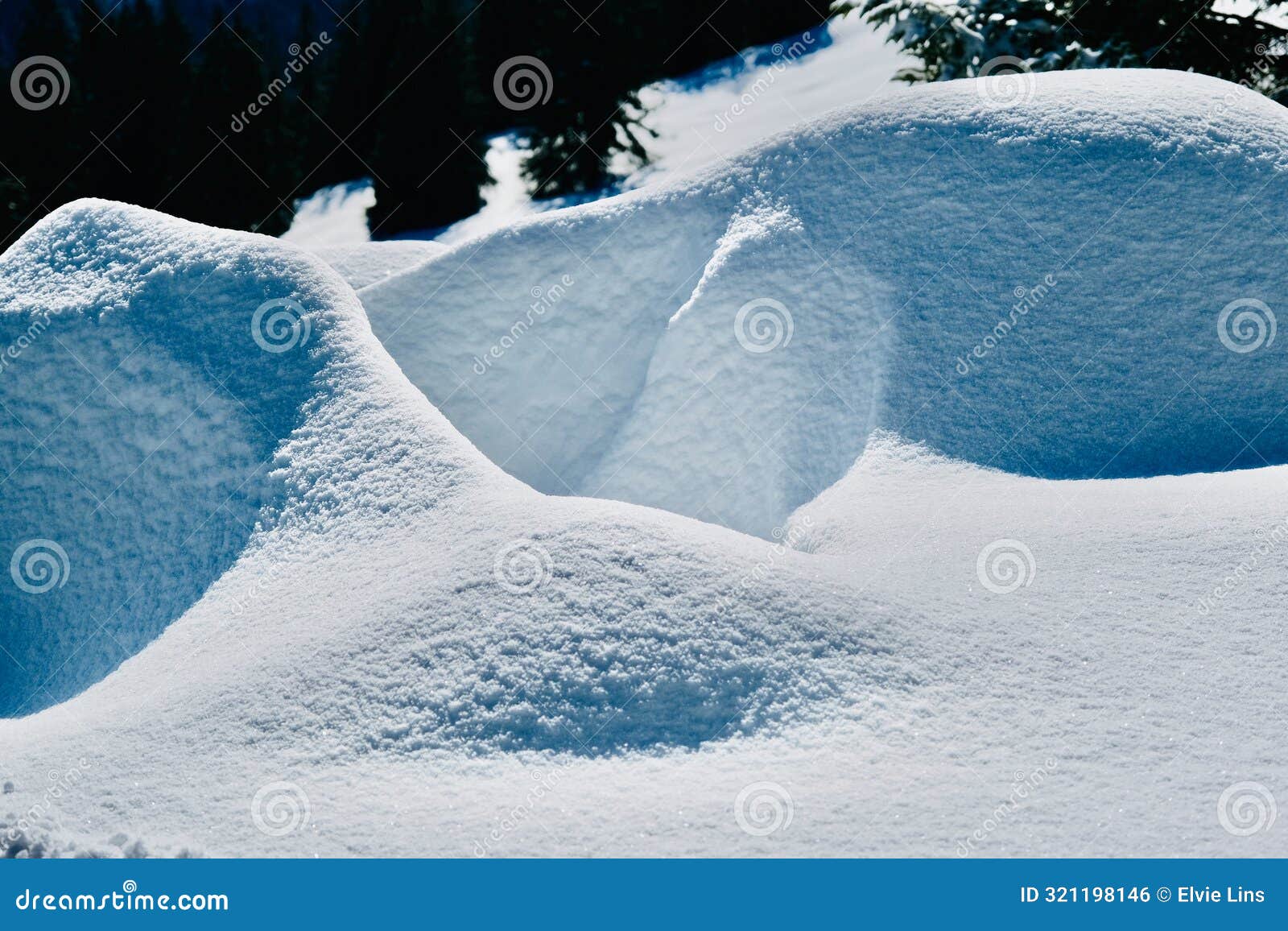 A Snow Covered Hill with a Large Mound of Snow Stock Photo - Image of ...