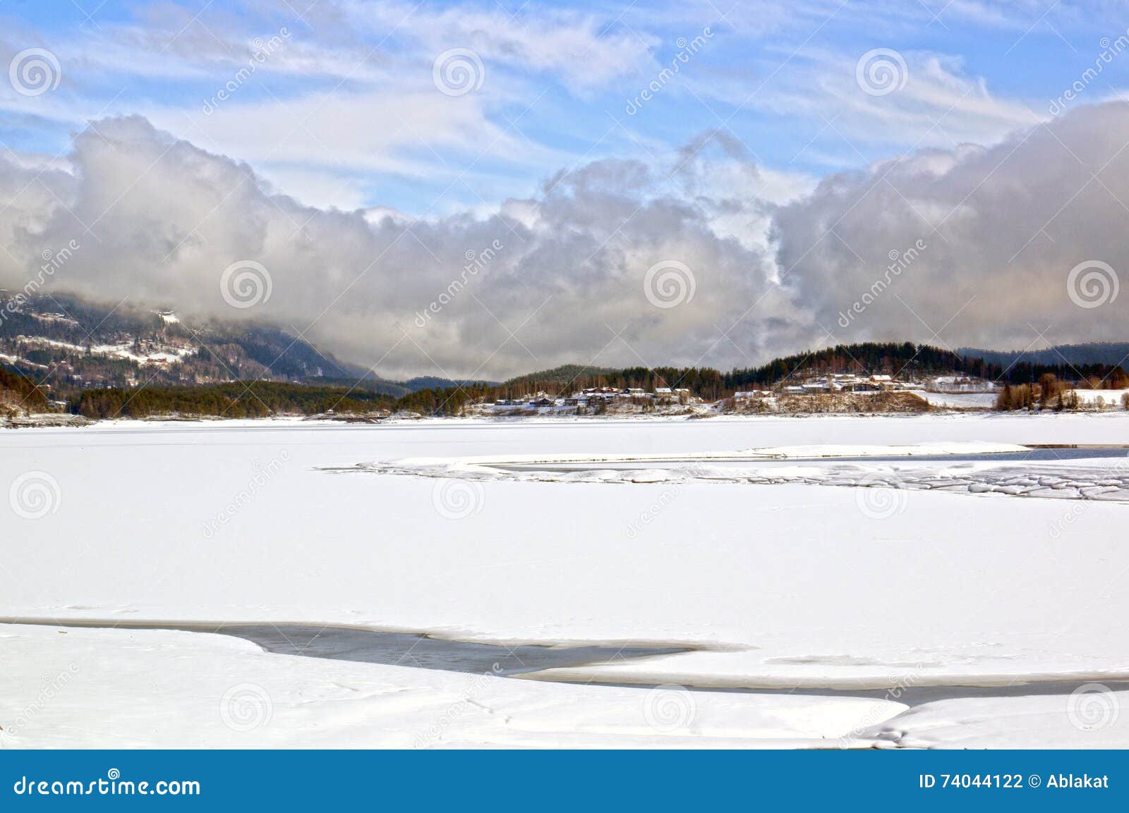 Snow-covered Lake, Mountains, Forests and Cumulus Clouds Stock Photo ...