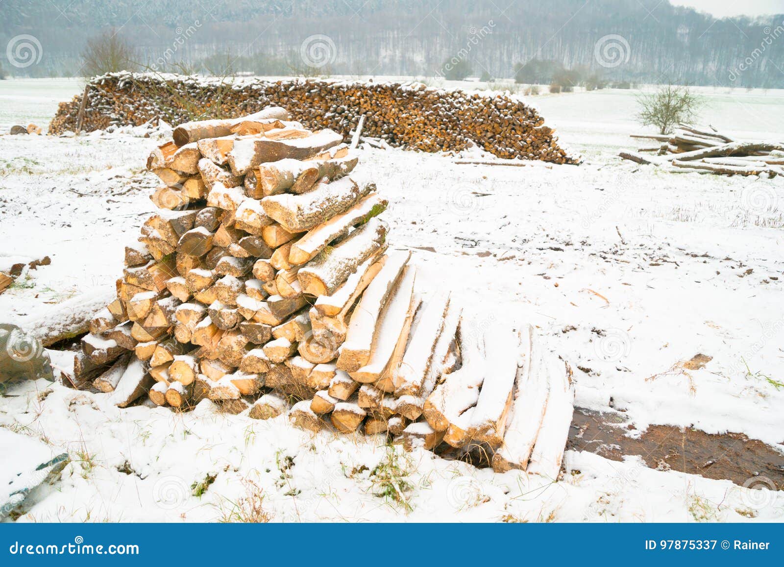Snow-covered log pile stock image. Image of warm, bark - 97875337