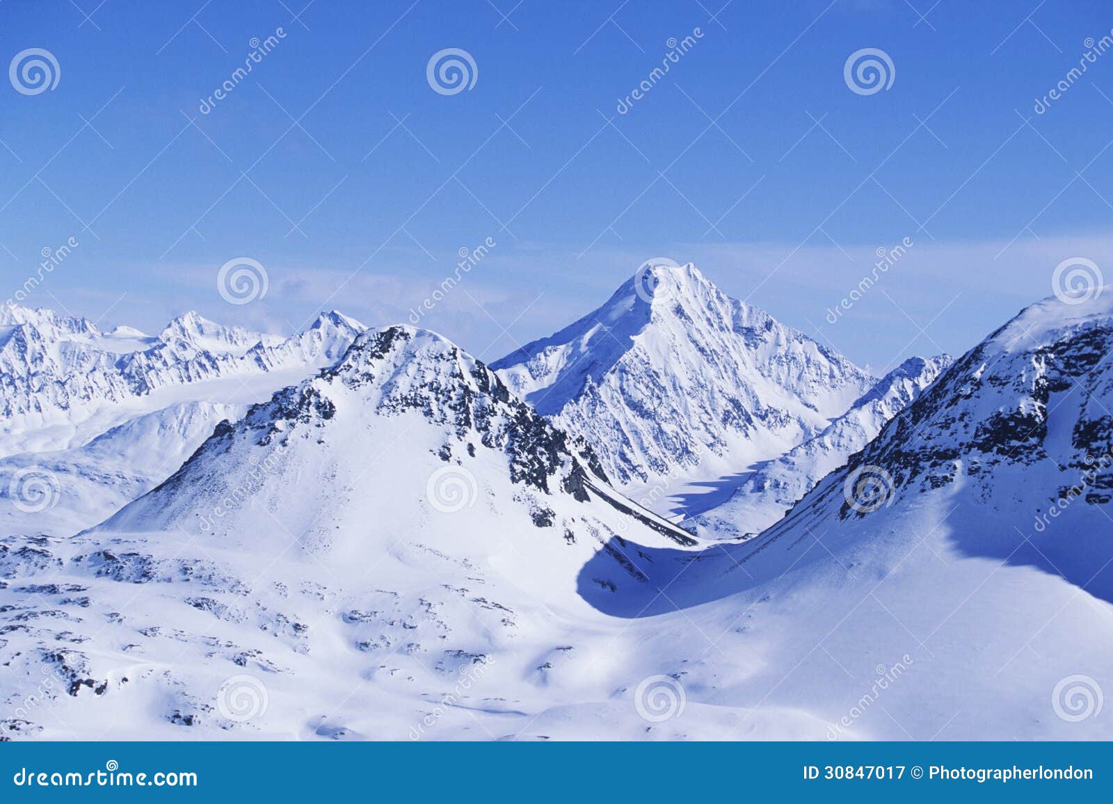 Snow-covered Mountain Range Stock Image - Image of desolate, mountains ...