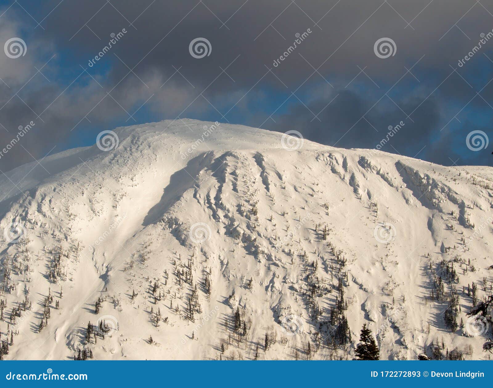Snow covered mountain top stock image. Image of season - 172272893