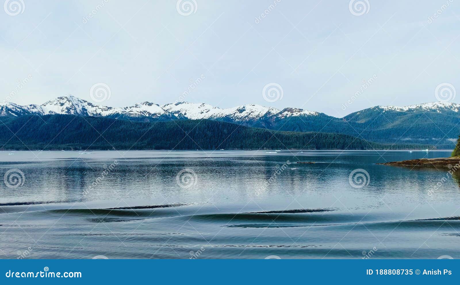 Snow Covered Mountain and Waves in the in Ocean Stock Image - Image of ...