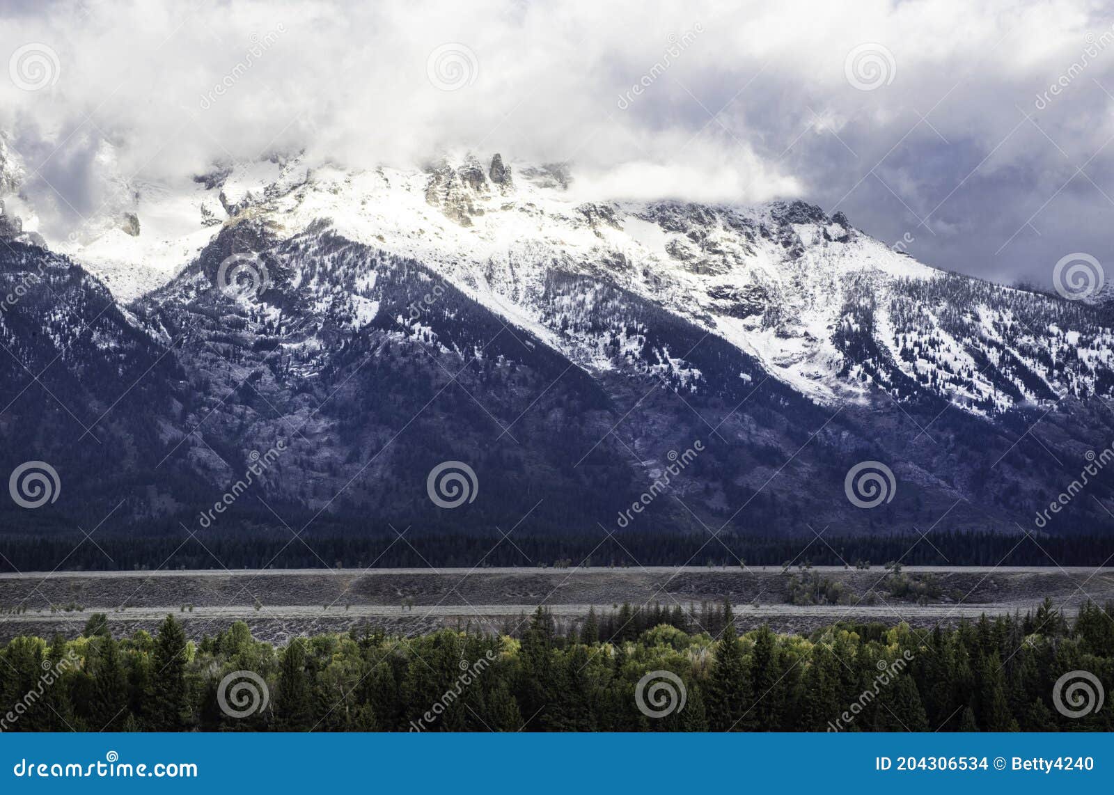 Snow Covered Mountains of the Grand Tetons. Stock Photo - Image of ...