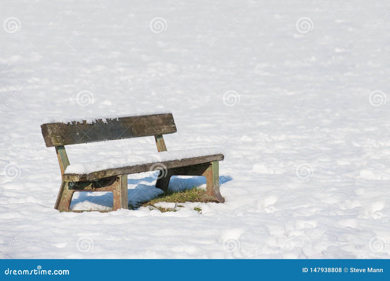 Snow covered park bench stock photo. Image of snow, parkbench - 147938808