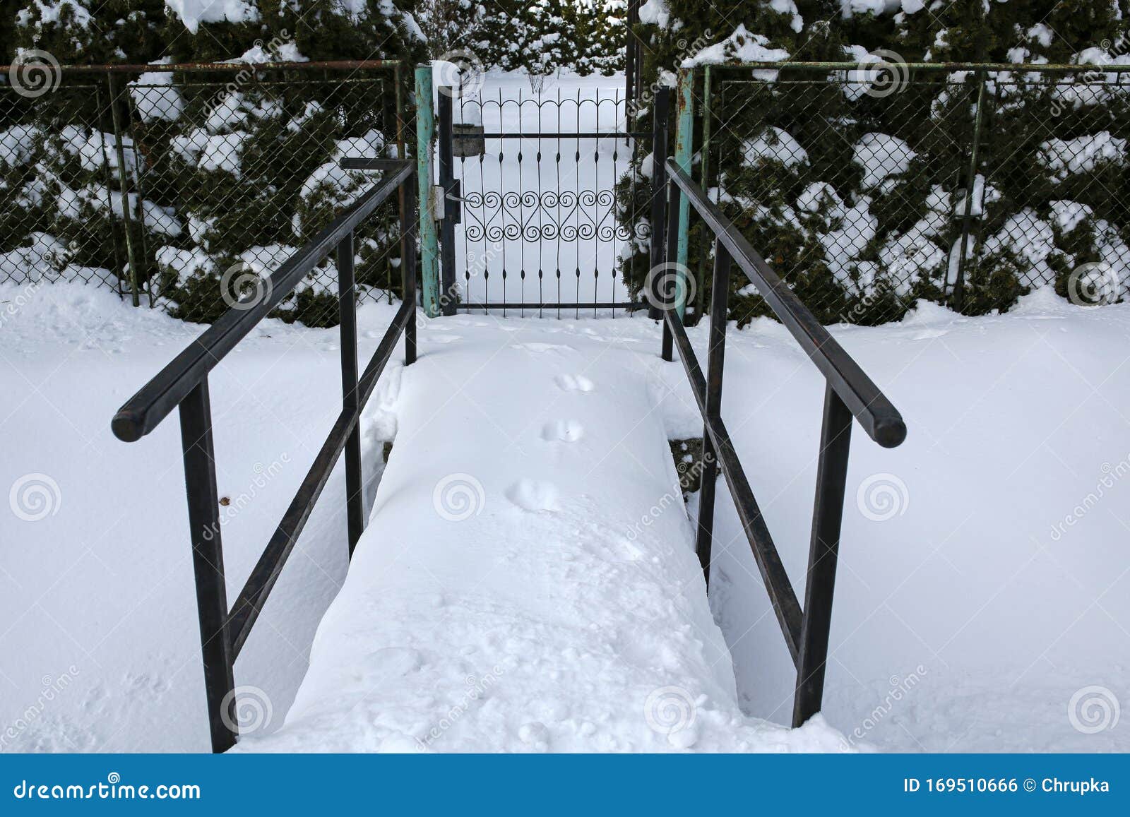 Snow-covered entrance gate stock photo. Image of blue - 169510666