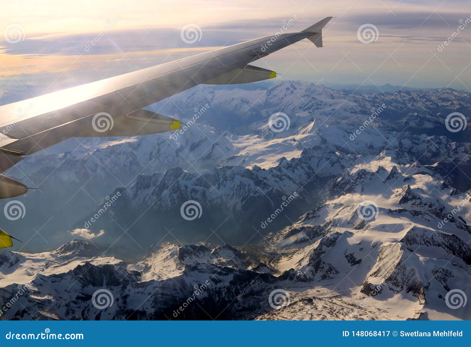 The Snow-covered Peaks of the Mountains from the Aircraft Stock Image ...