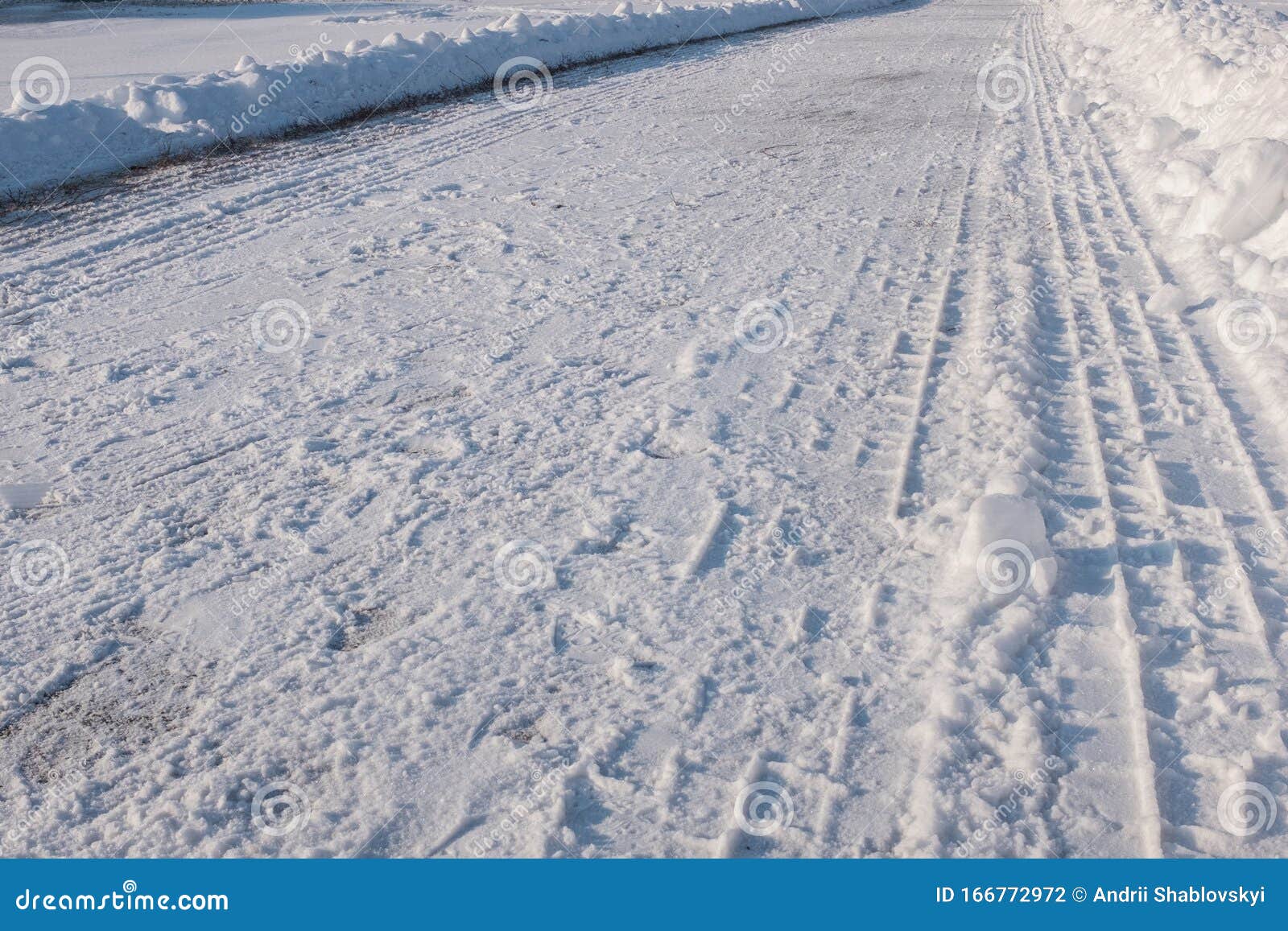 A Snow-covered Road in the Winter Season Stock Photo - Image of track ...