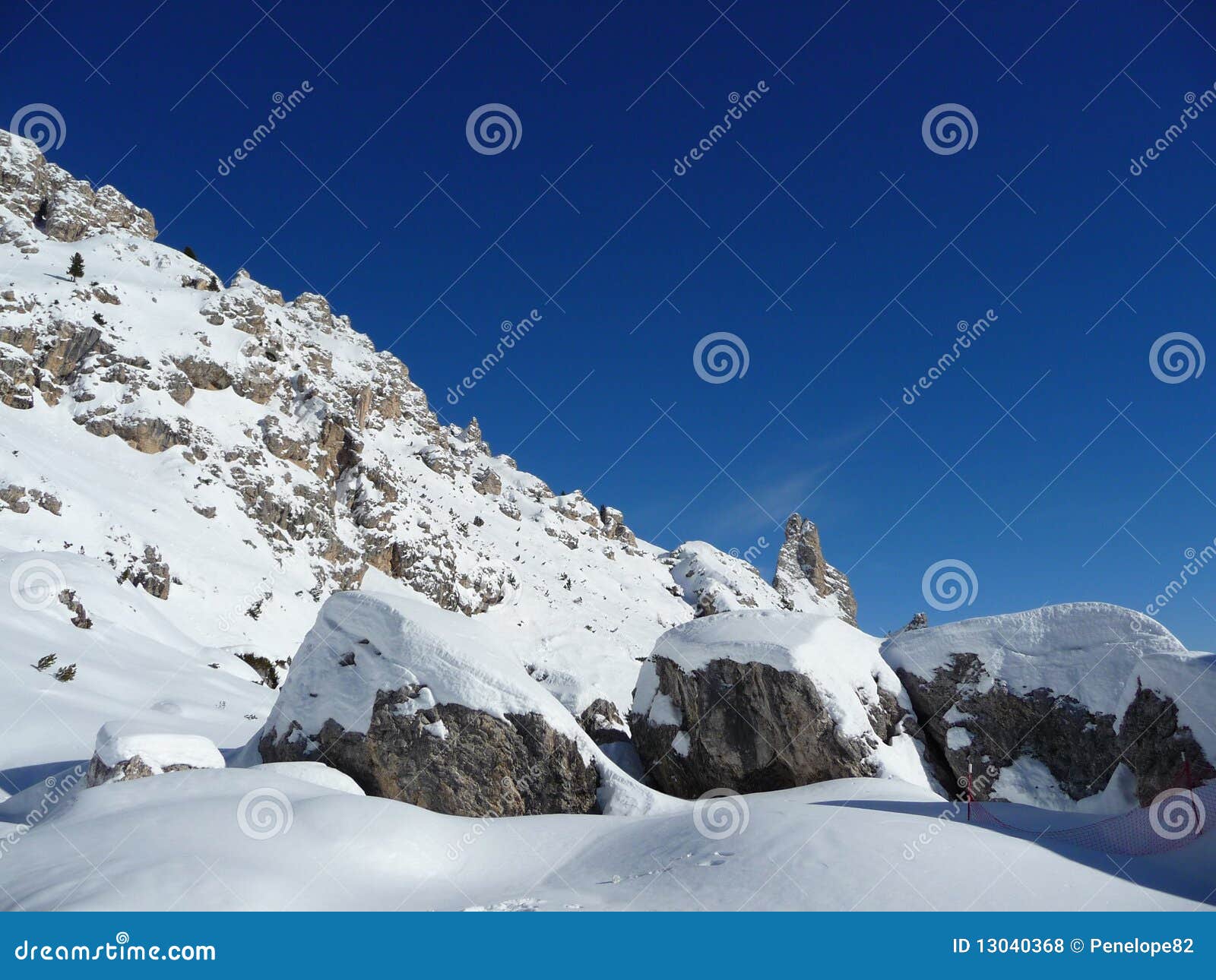 Snow covered rocks stock photo. Image of shadow, snow - 13040368