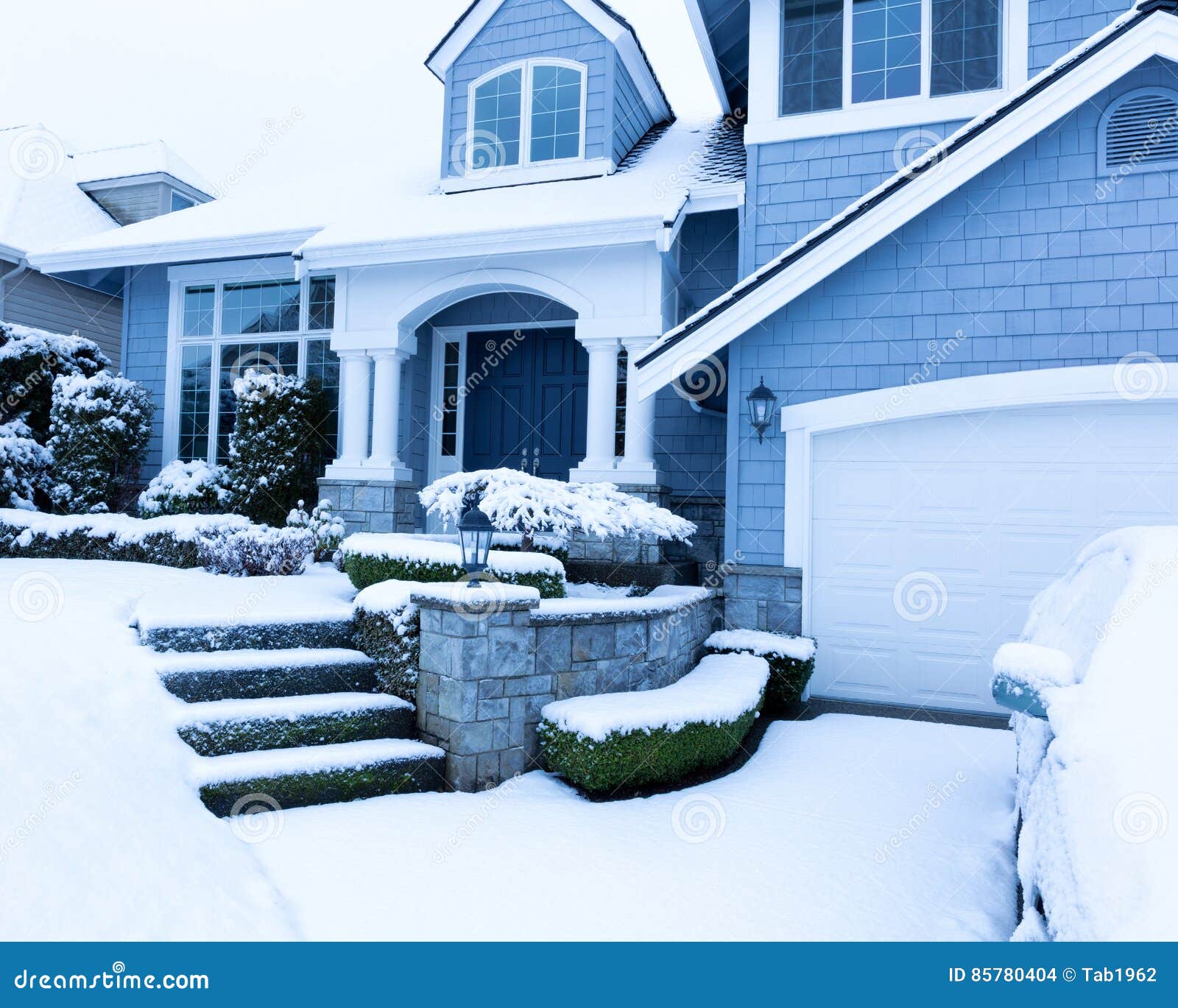 Snow Covered Sidewalk in Front of Home during Winter Snowfall Stock ...