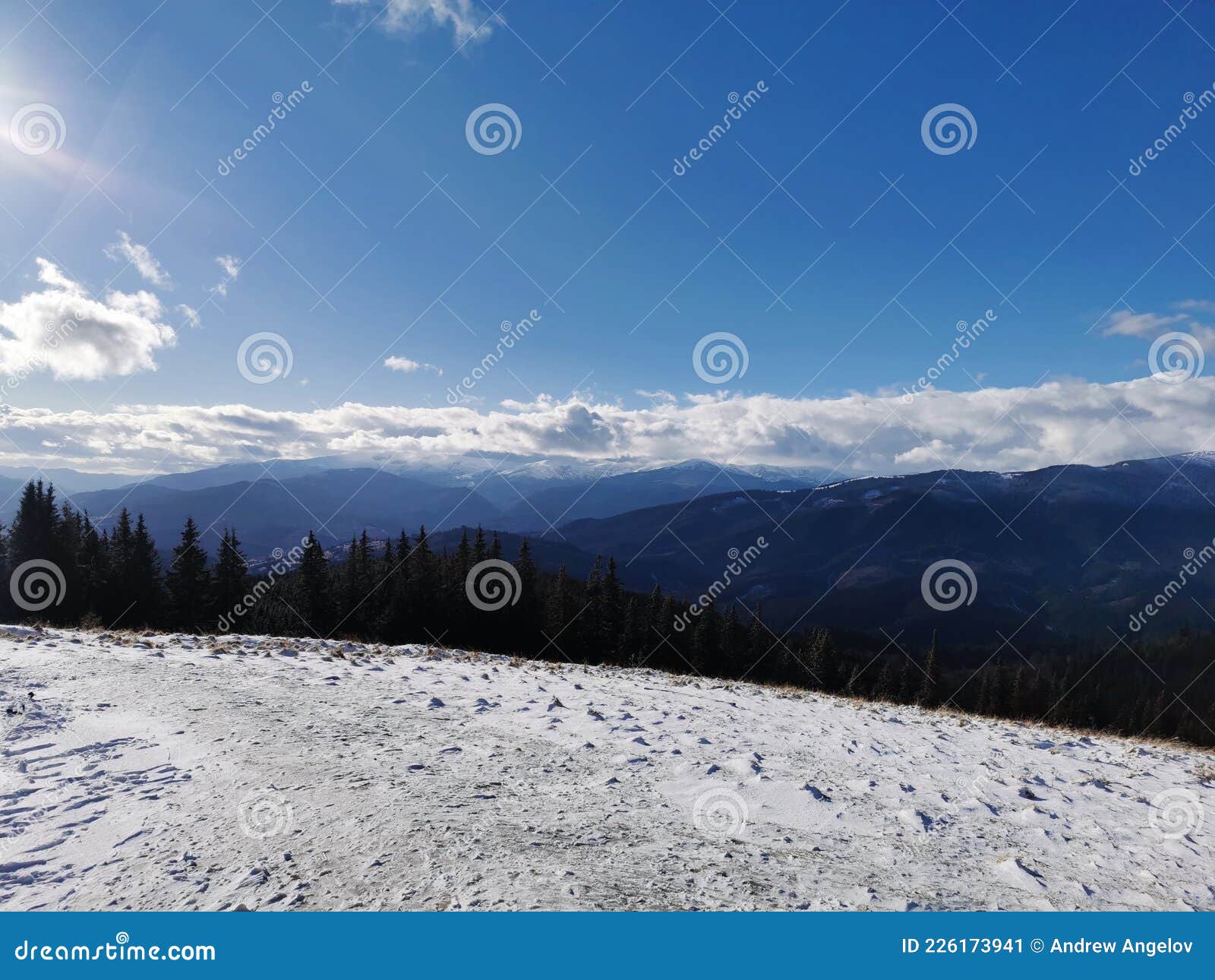 A Snow Covered Slope Side of a Snow Covered Mountain Stock Image ...