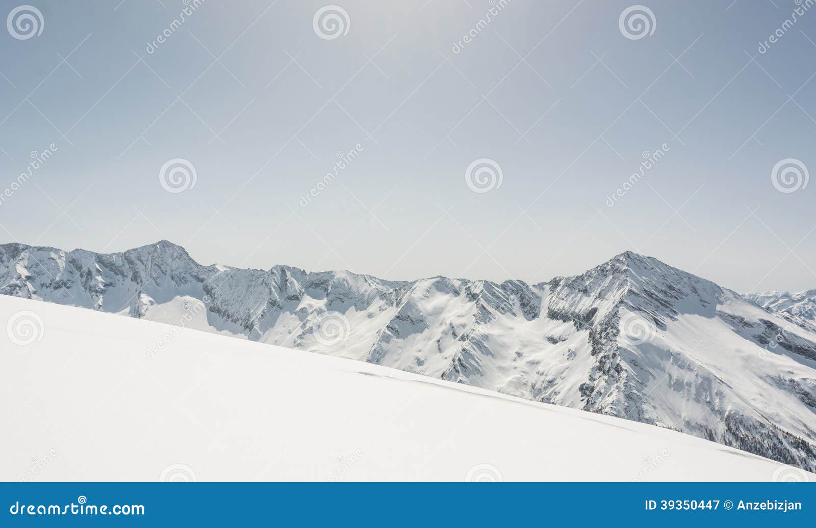 Snow Covered Slope with Mountain Ridge in the Back Stock Image - Image ...