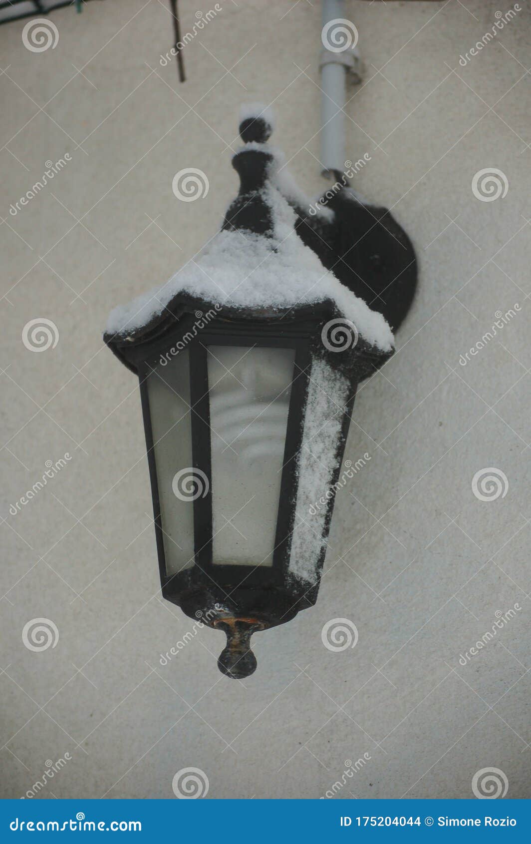 Snow-covered street lamp stock photo. Image of city - 175204044