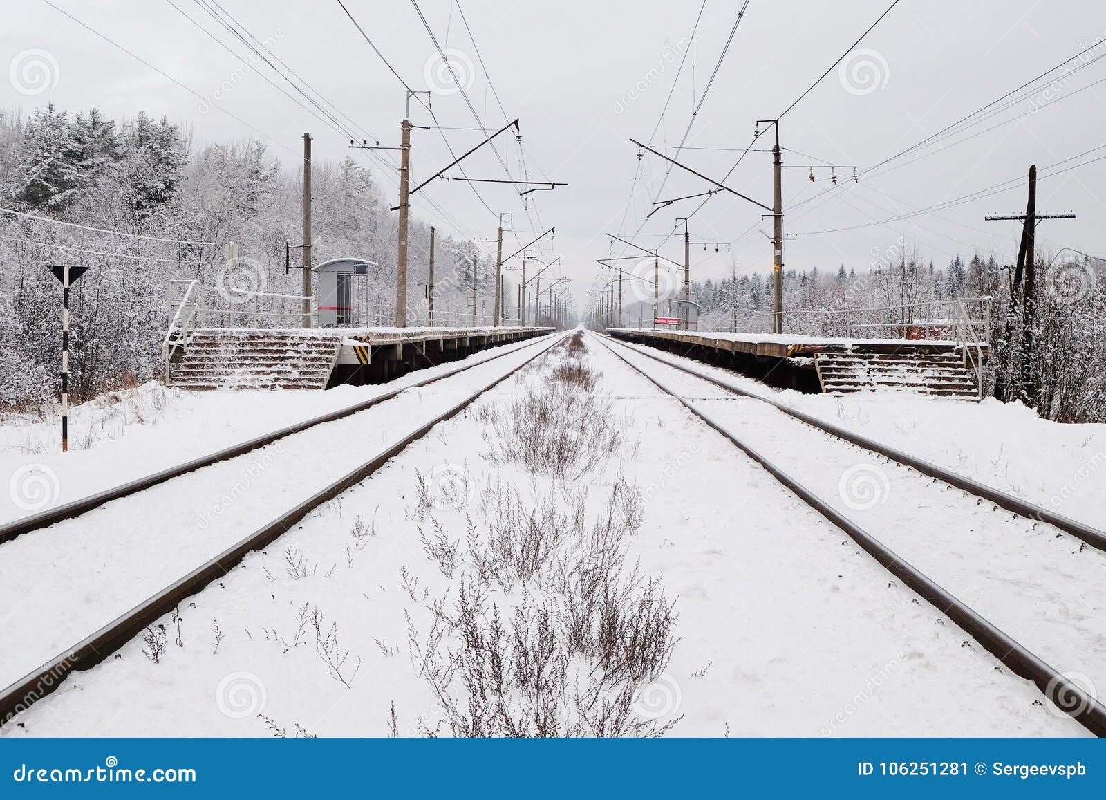 Snow-covered train tracks stock image. Image of platform - 106251281