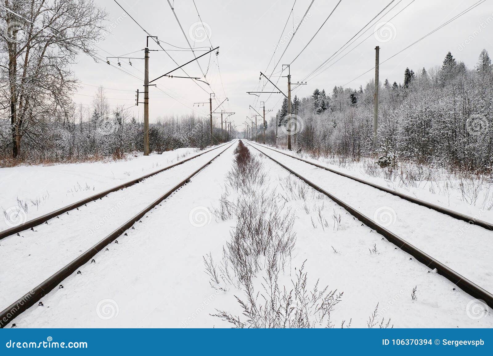 Snow-covered train tracks stock photo. Image of winter - 106370394