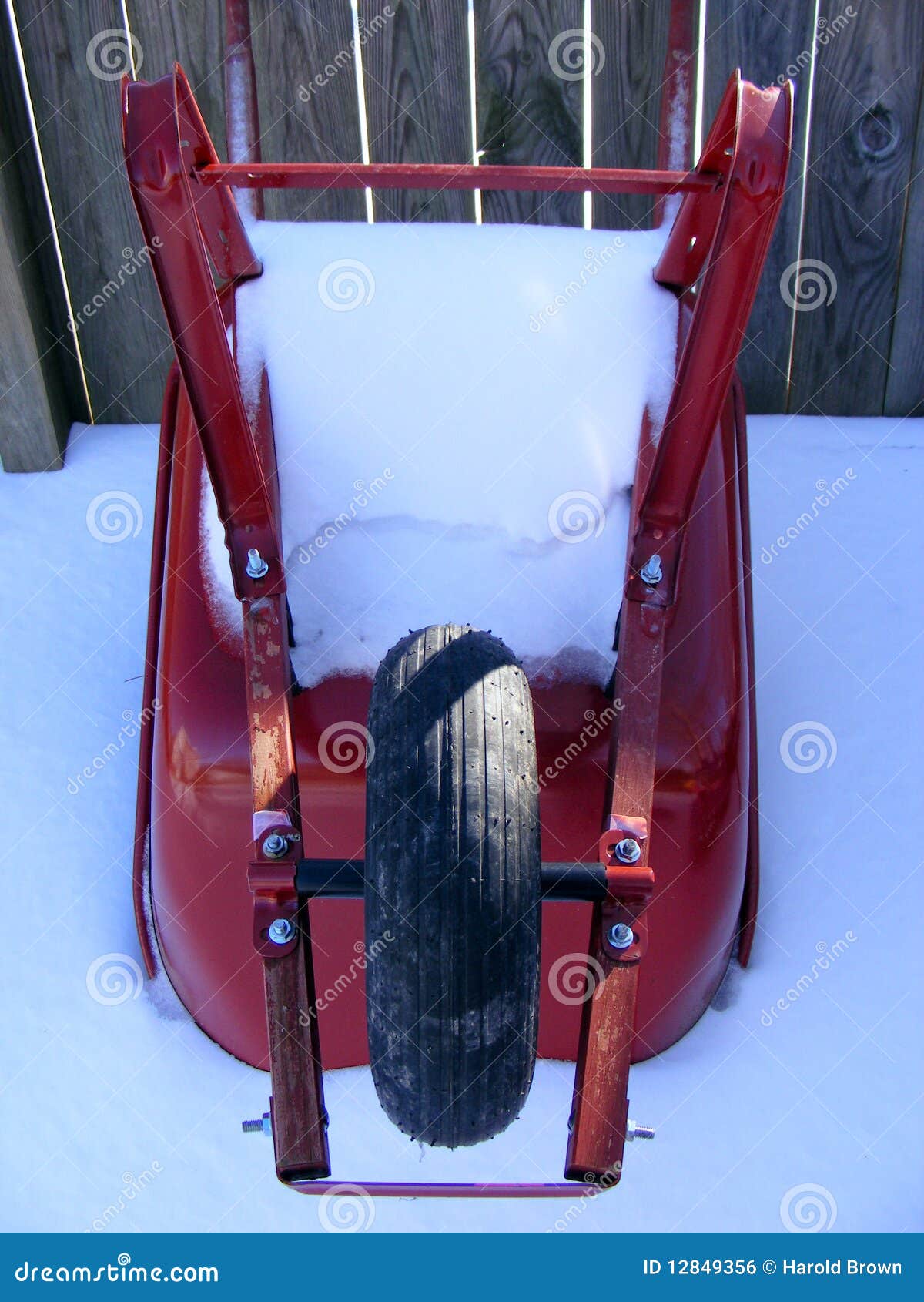 Snow Covered Wheelbarrow stock photo. Image of work, barrow - 12849356