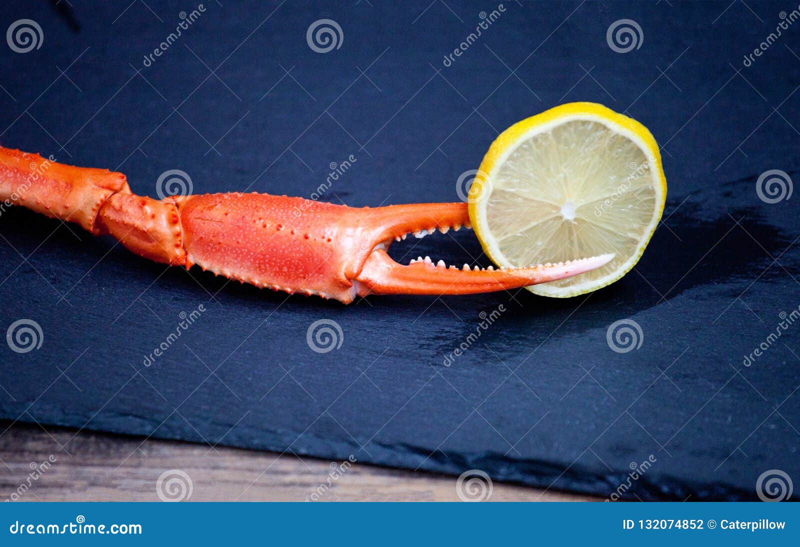 Snow Crab Claw with Lemon on a Table. Selective Focus Stock Photo ...