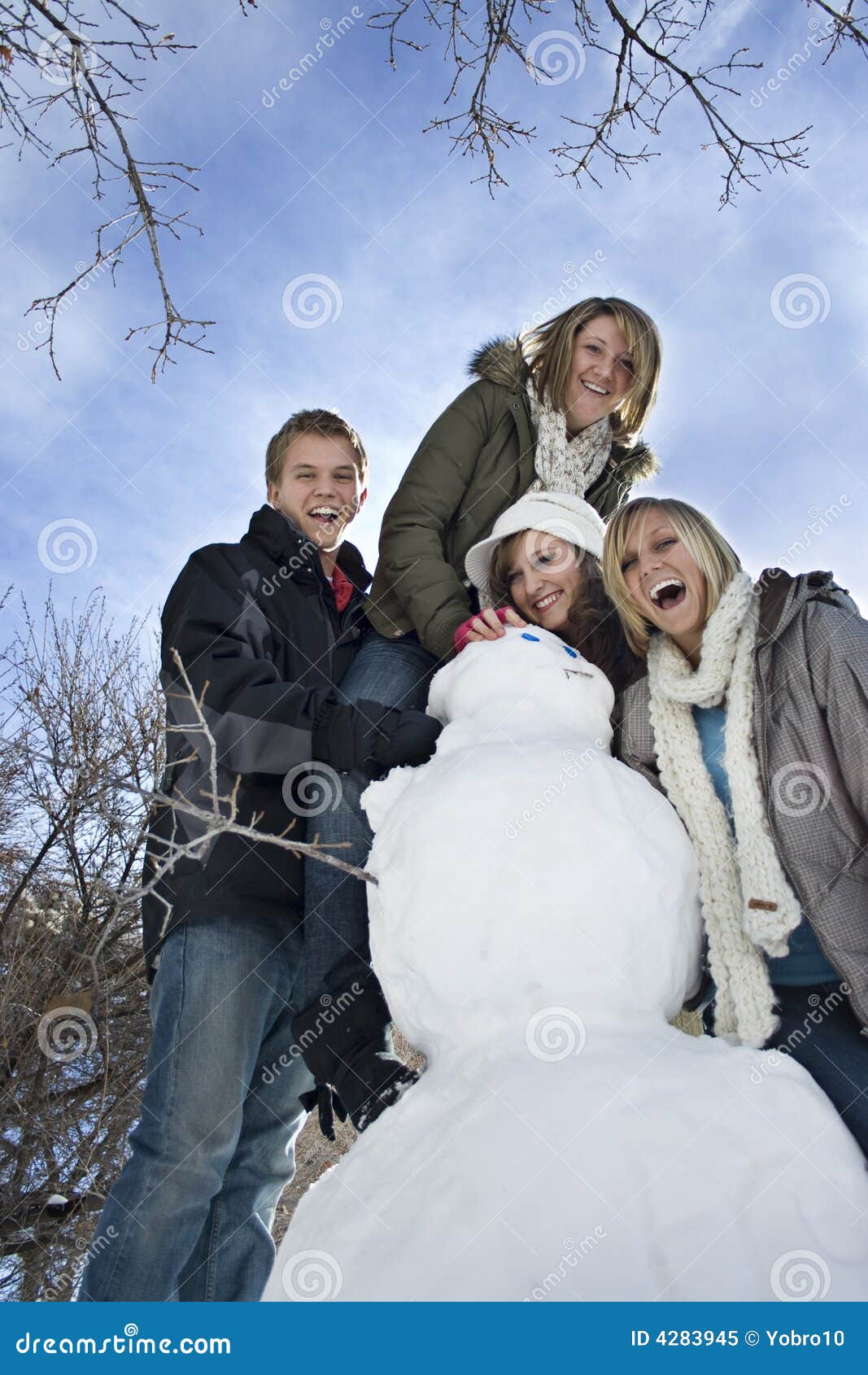 Snow Day Fun with Snowman stock image. Image of play, adults - 4283945