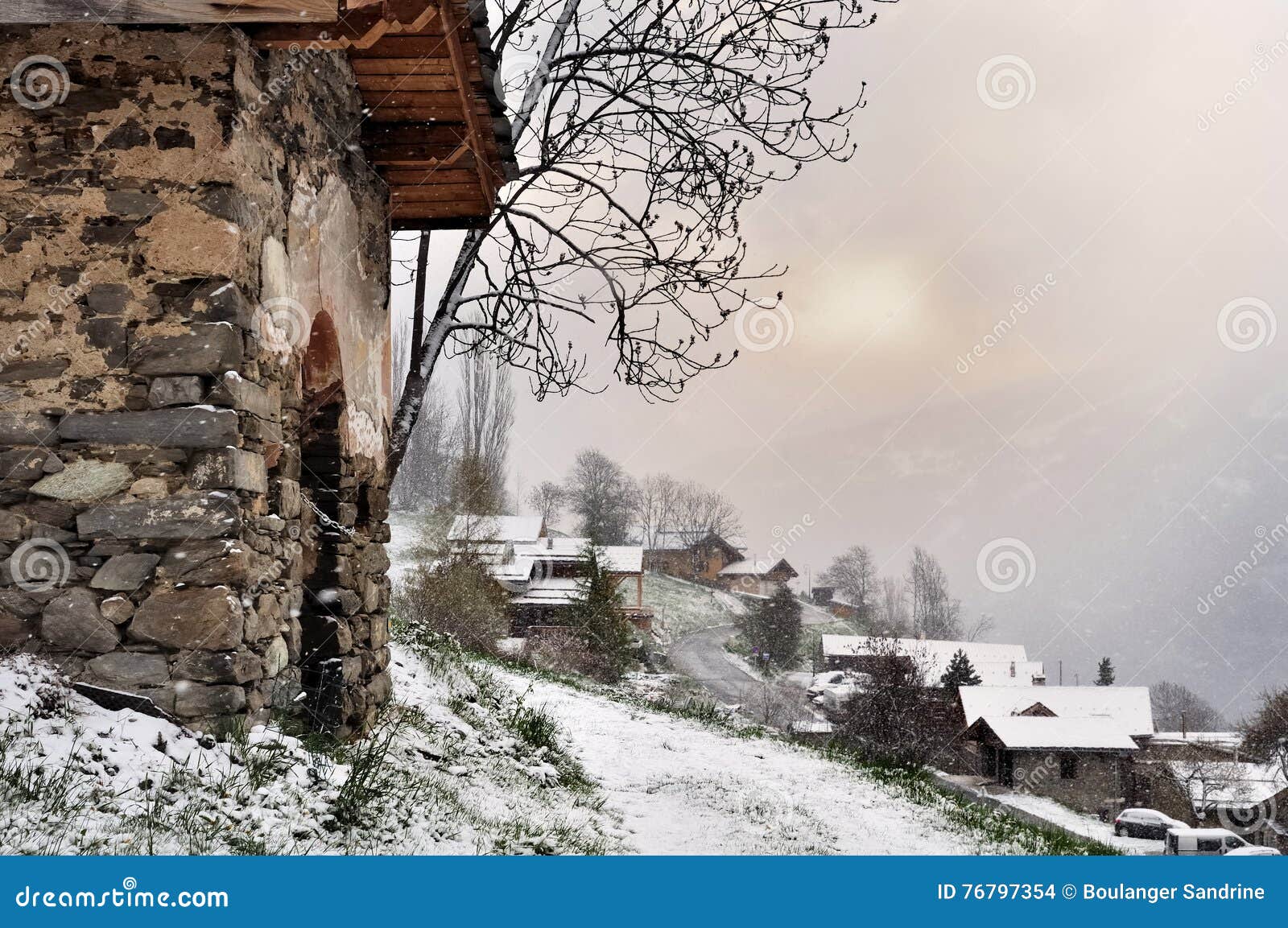 Snow fall on a village stock photo. Image of cloudy, winter - 76797354