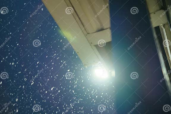 Snow Falling at Night Under a Lamp Post Stock Photo - Image of ...