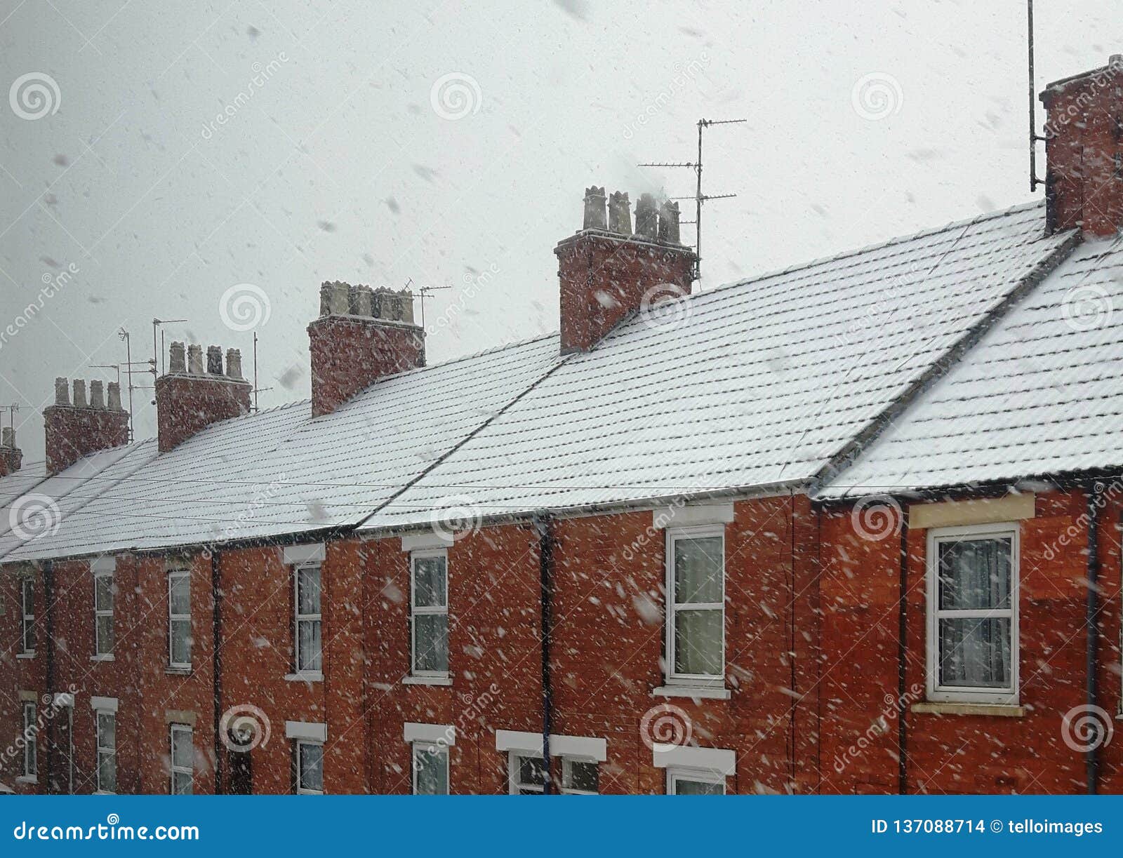 Snow Falling Over Red Brick Houses Rooftops Stock Photo - Image of ...