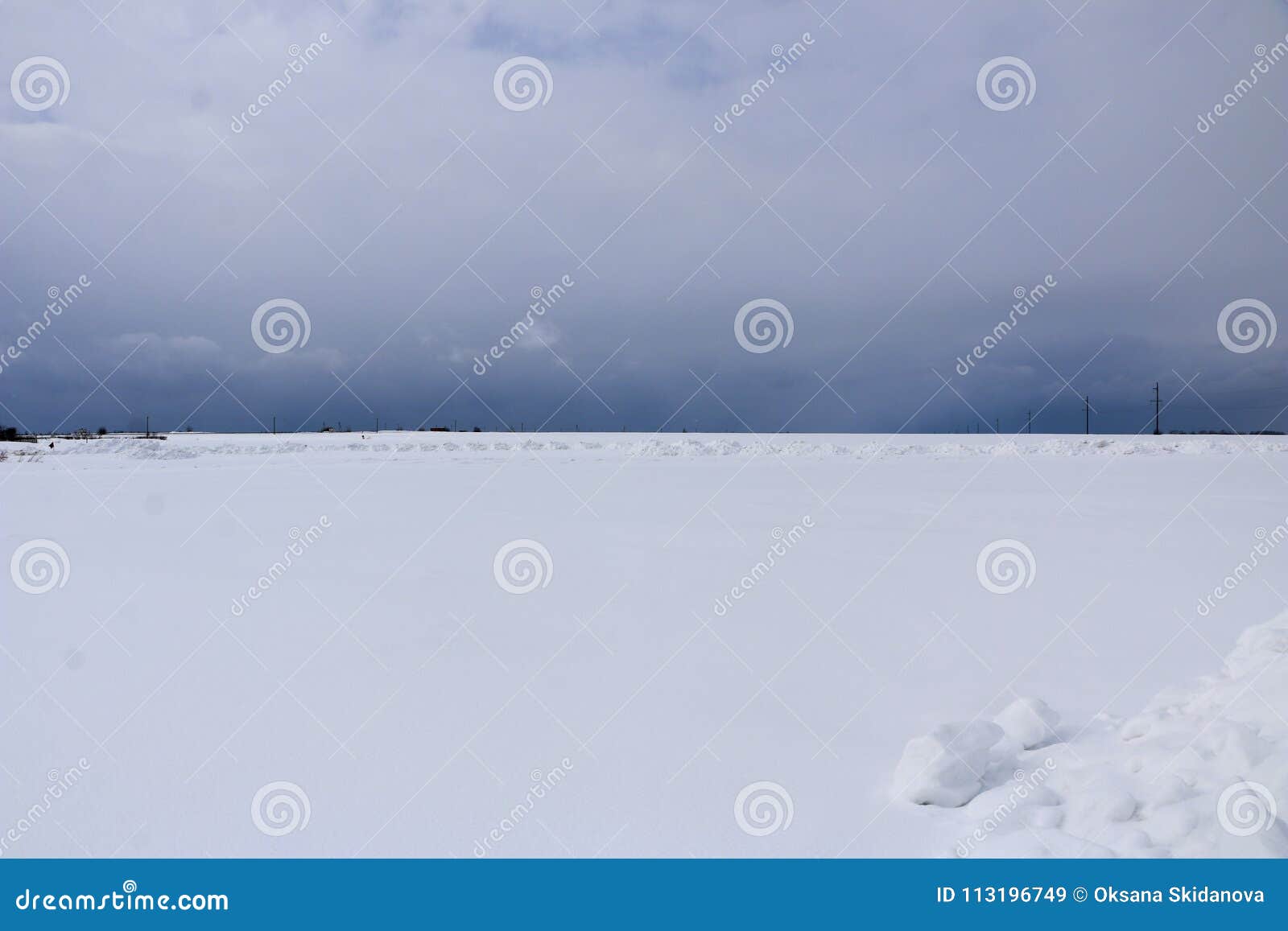 Snow Field. the Plain is Covered with White Snow Under a Blue Sky with ...