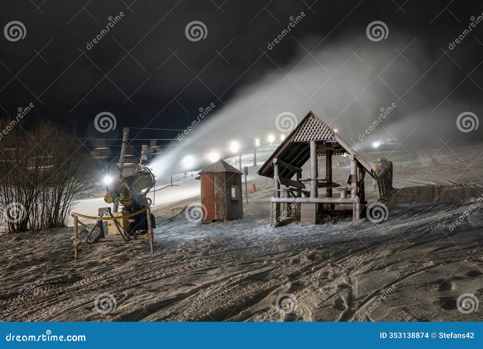 Snow Gun Making Snow at Night on the Ski Slope. Snow Making System at ...