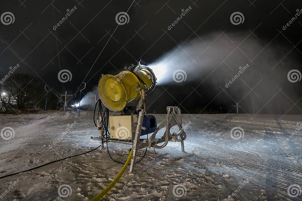 Snow Gun Making Snow at Night on the Ski Slope. Snow Making System at ...