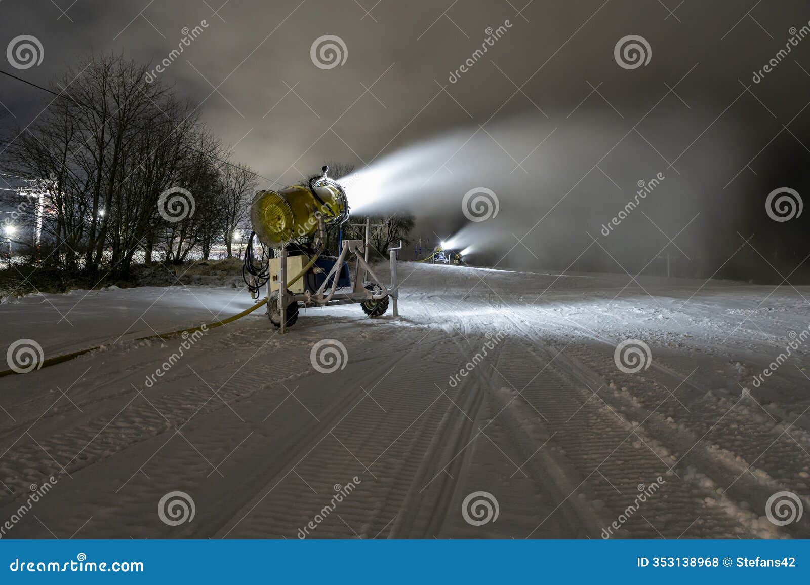 Snow Gun Making Snow at Night on the Ski Slope. Snow Making System at ...
