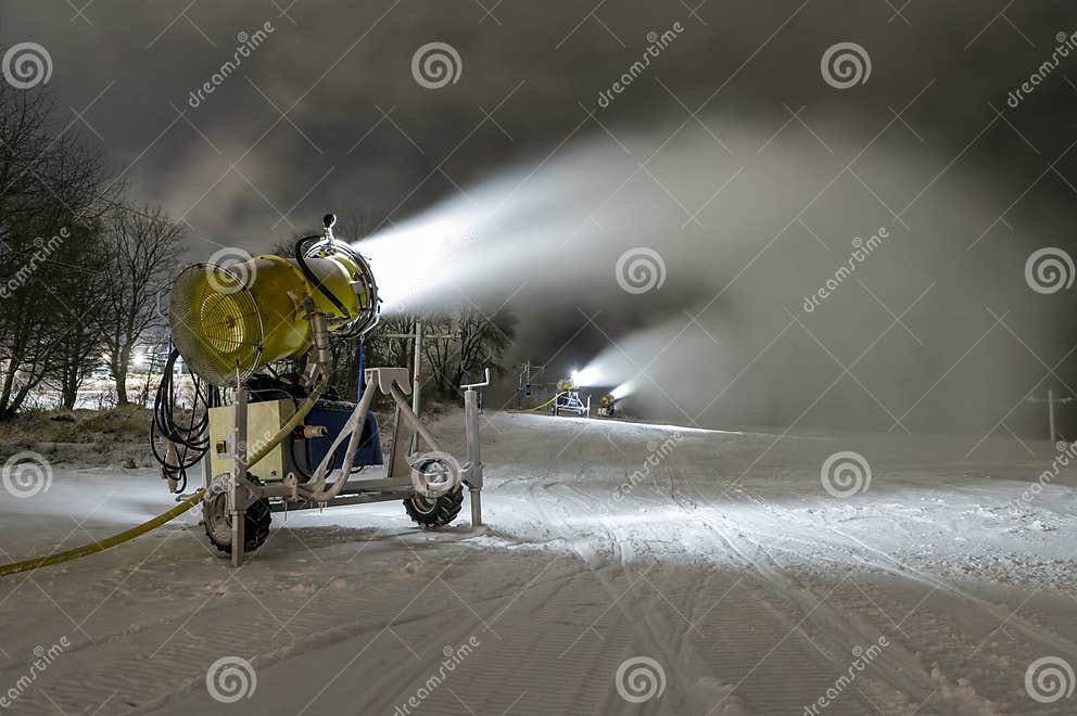 Snow Gun Making Snow at Night on the Ski Slope. Snow Making System at ...