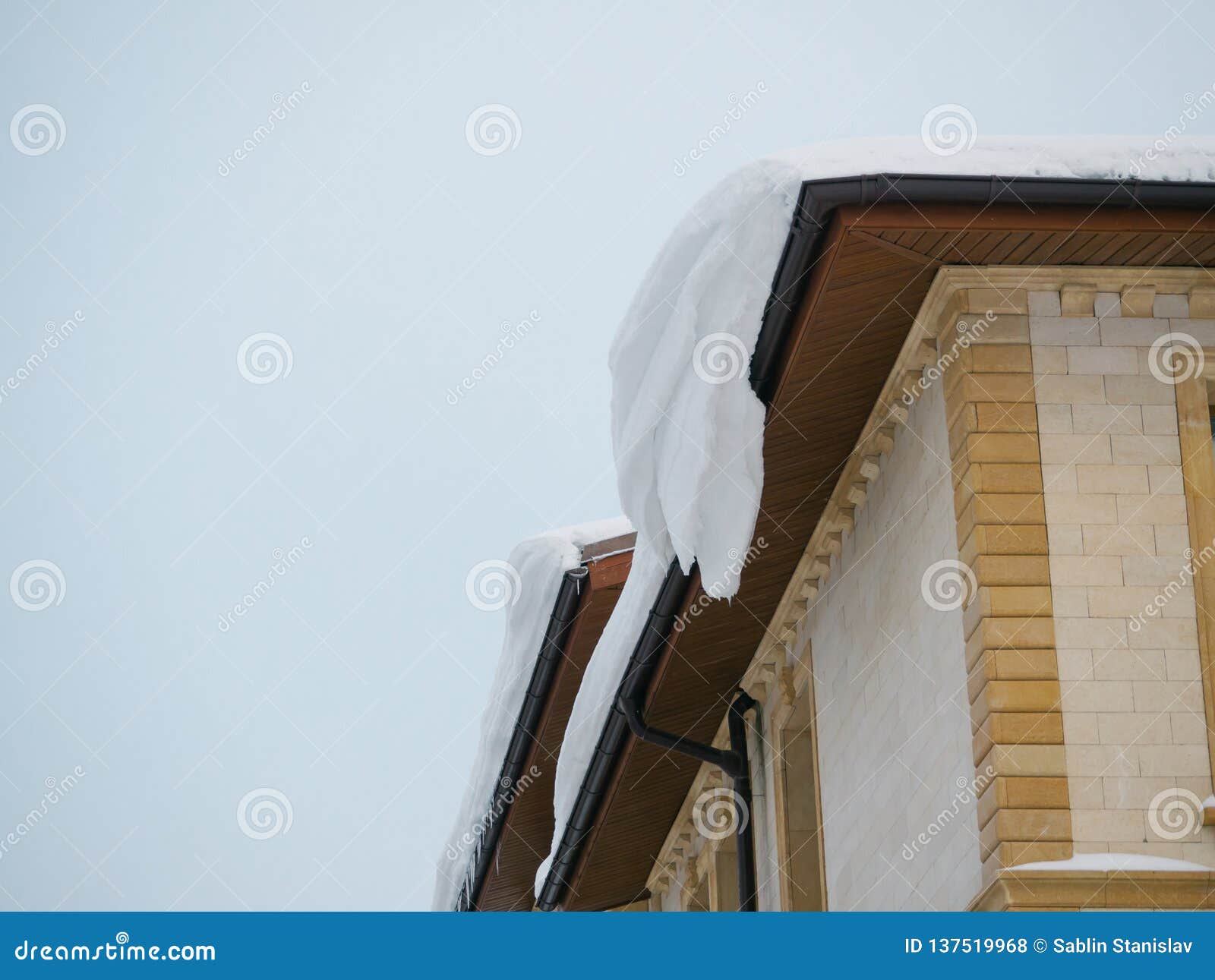 Snow Hanging from the Roof of the Building. Stock Photo - Image of cool ...