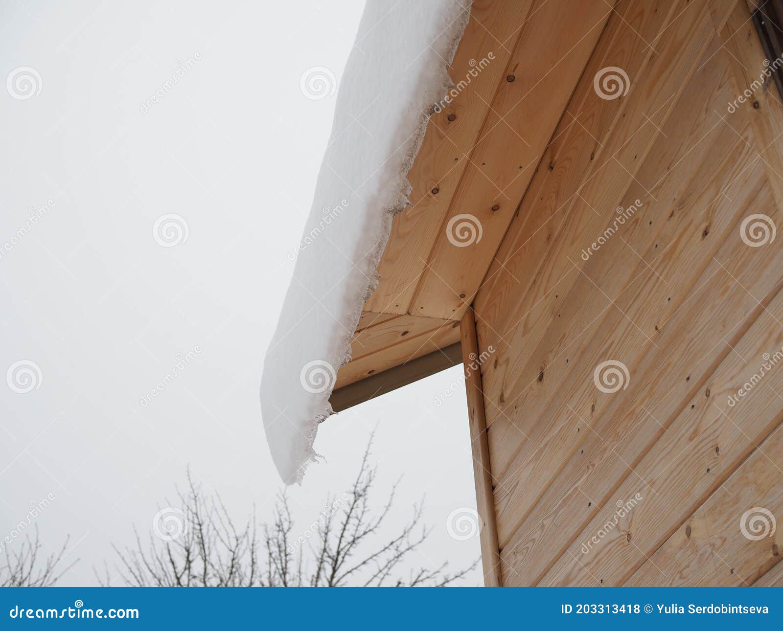 Snow is Hanging from the Roof of the House Stock Photo - Image of ...