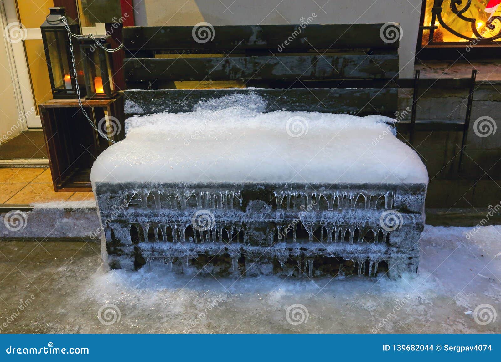 Snow and ice covered bench stock photo. Image of icicle - 139682044