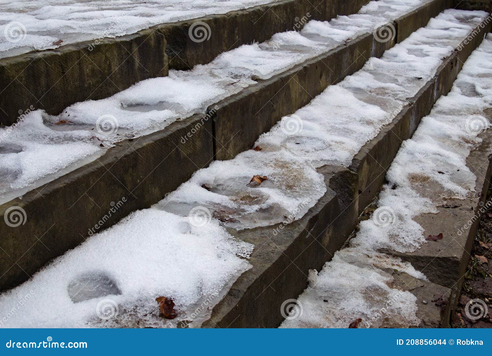 Snow and Ice Covered Stairs in Winter with Footprints Stock Photo ...