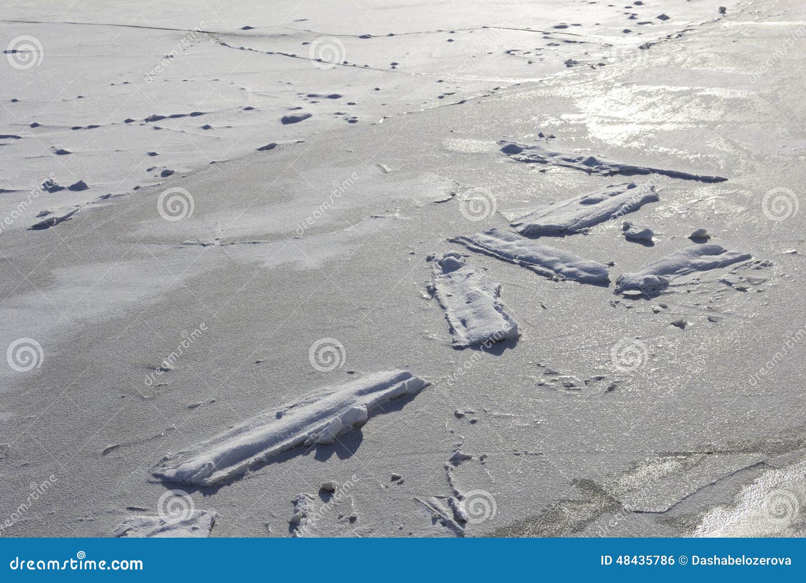 Snow on ice at sunny day stock photo. Image of frozen - 48435786