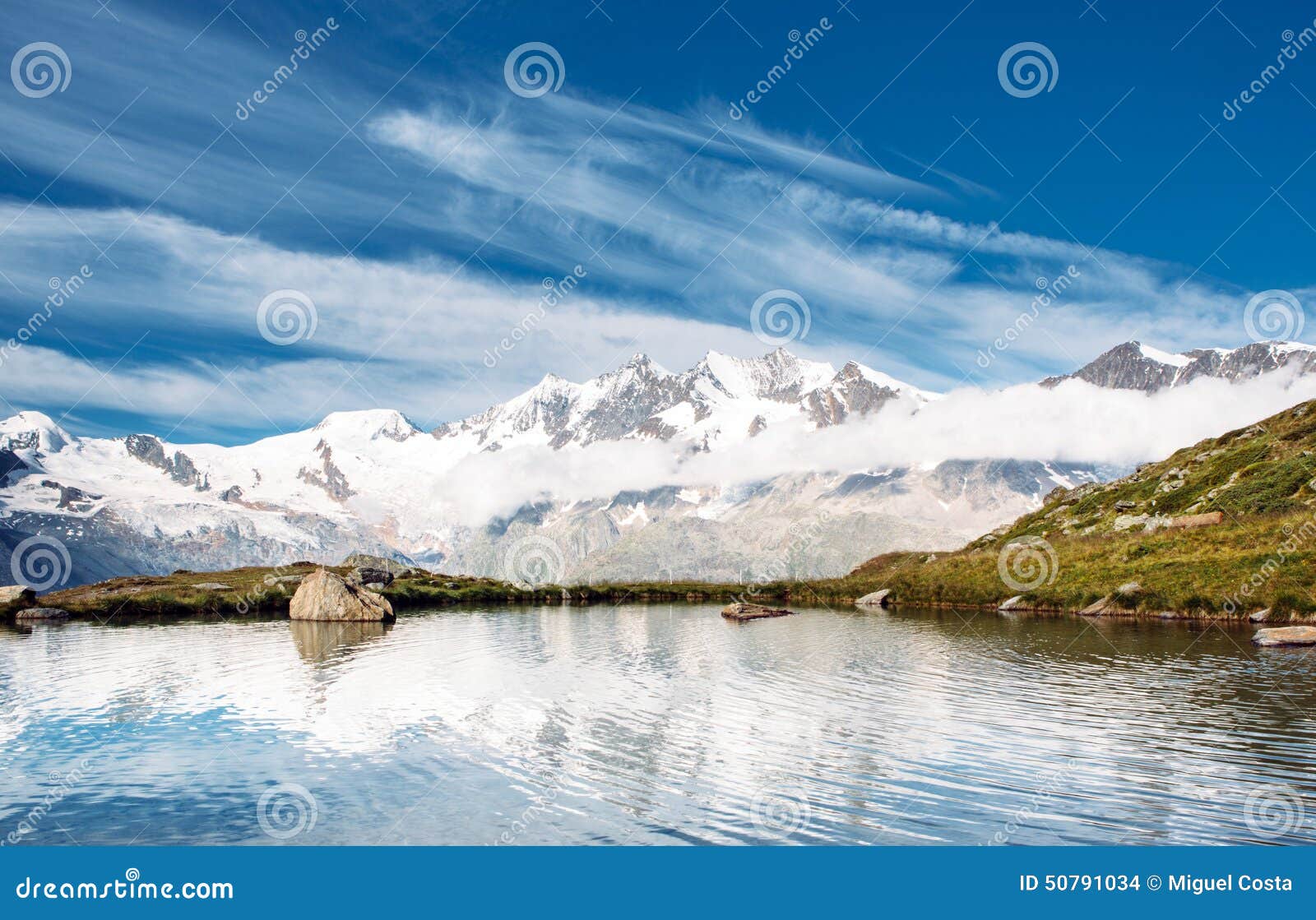 Snow mountain lake stock photo. Image of clouds, blue - 50791034