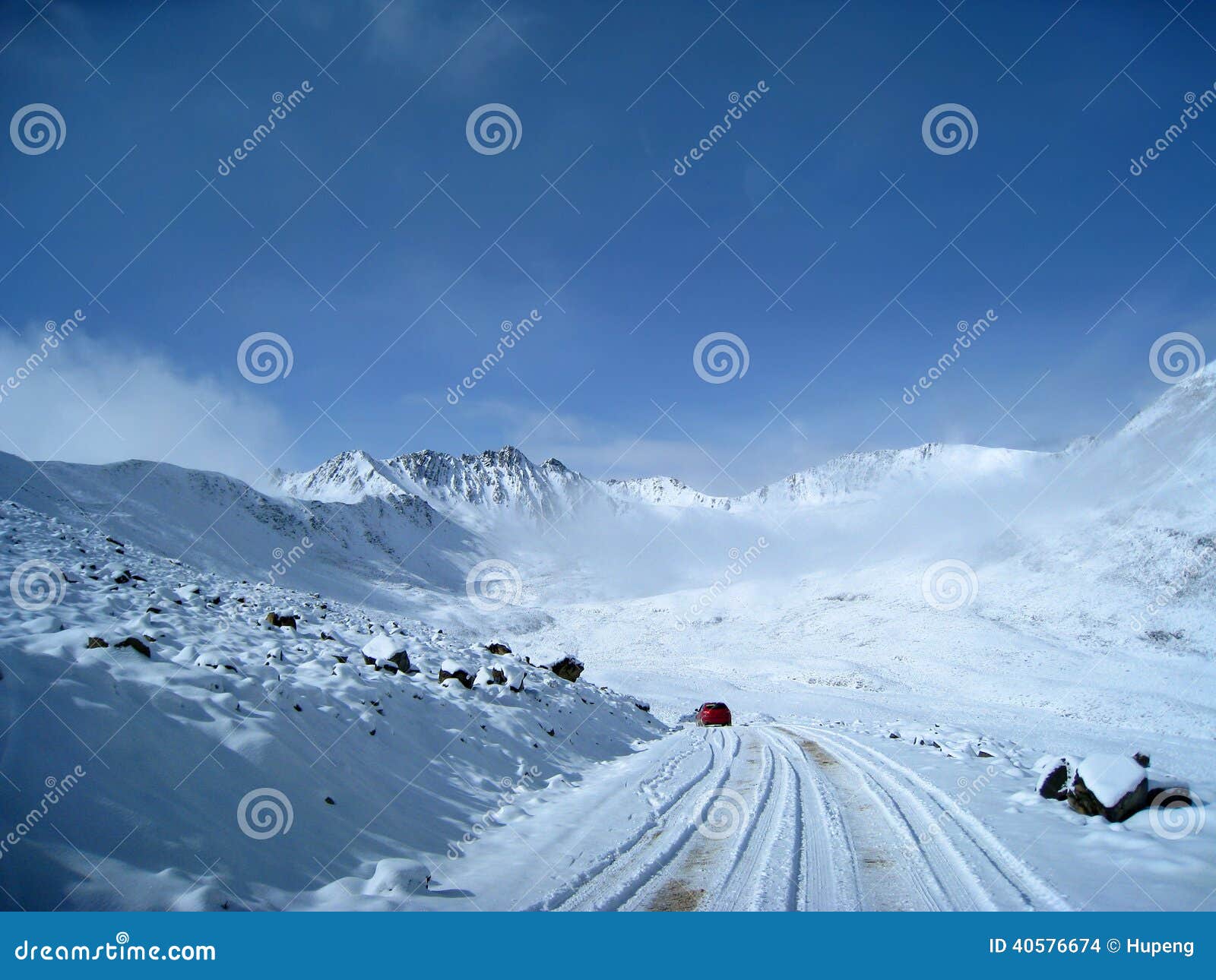 Snow mountain with red car stock photo. Image of driving - 40576674