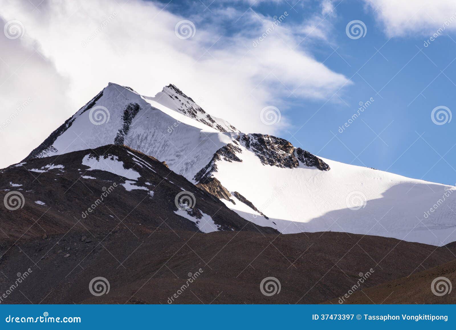 Snow mountains cloudy sky stock image. Image of background - 37473397
