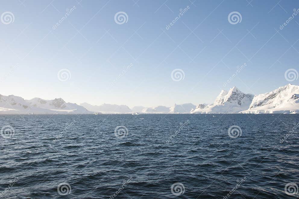 Snow mountains and ocean stock image. Image of area, glacier - 26731065