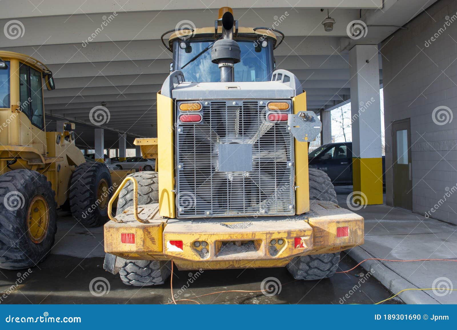 Snow Mover Wheel Loader Machine Parked in Parkade Stock Photo - Image ...